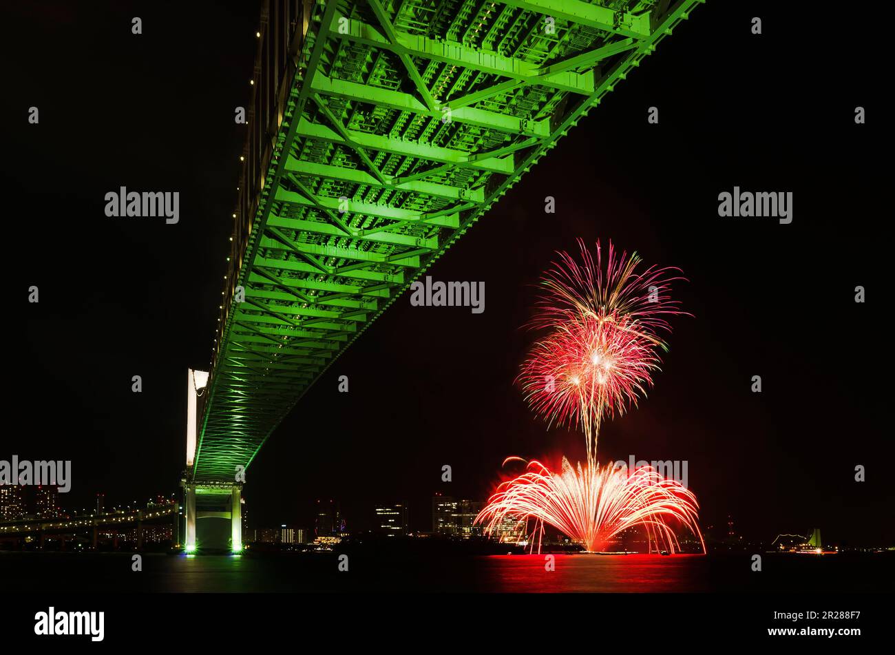 Odaiba Rainbow Bridge and looking up at rainbow fireworks Stock Photo ...