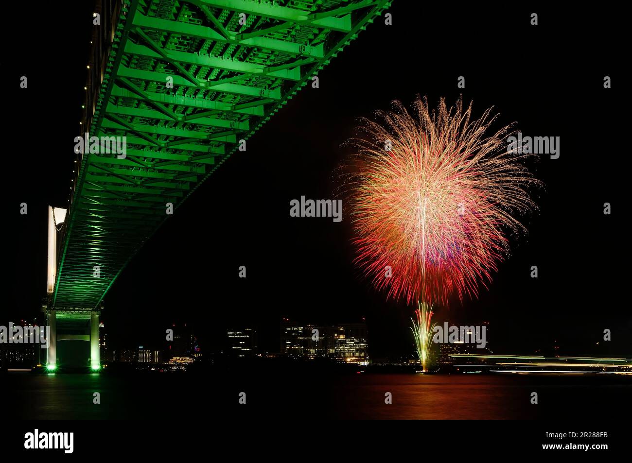 Odaiba Rainbow Bridge and looking up at rainbow fireworks Stock Photo ...