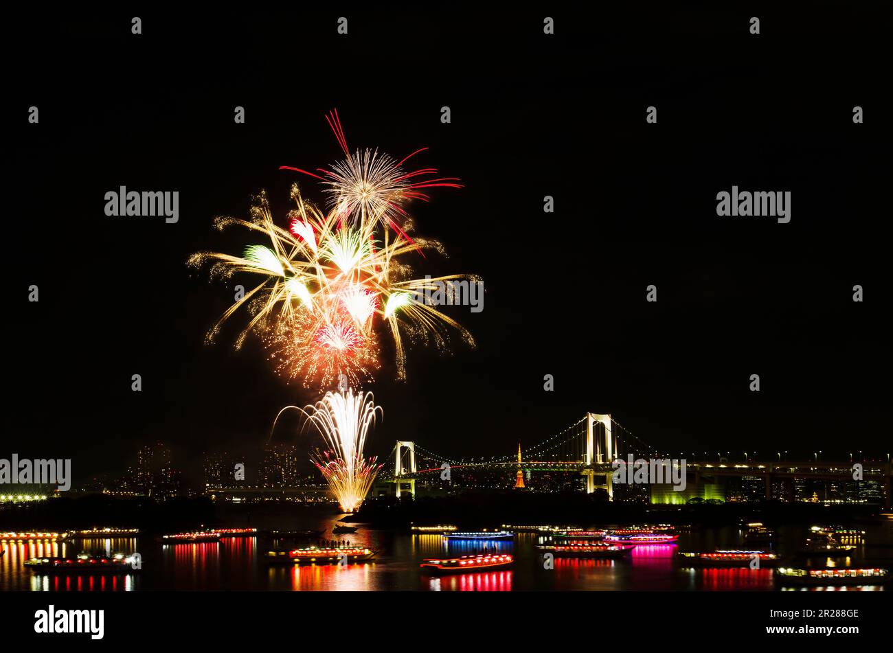 Odaiba Rainbow Fireworks, Rainbow Bridge and houseboat at night Stock ...