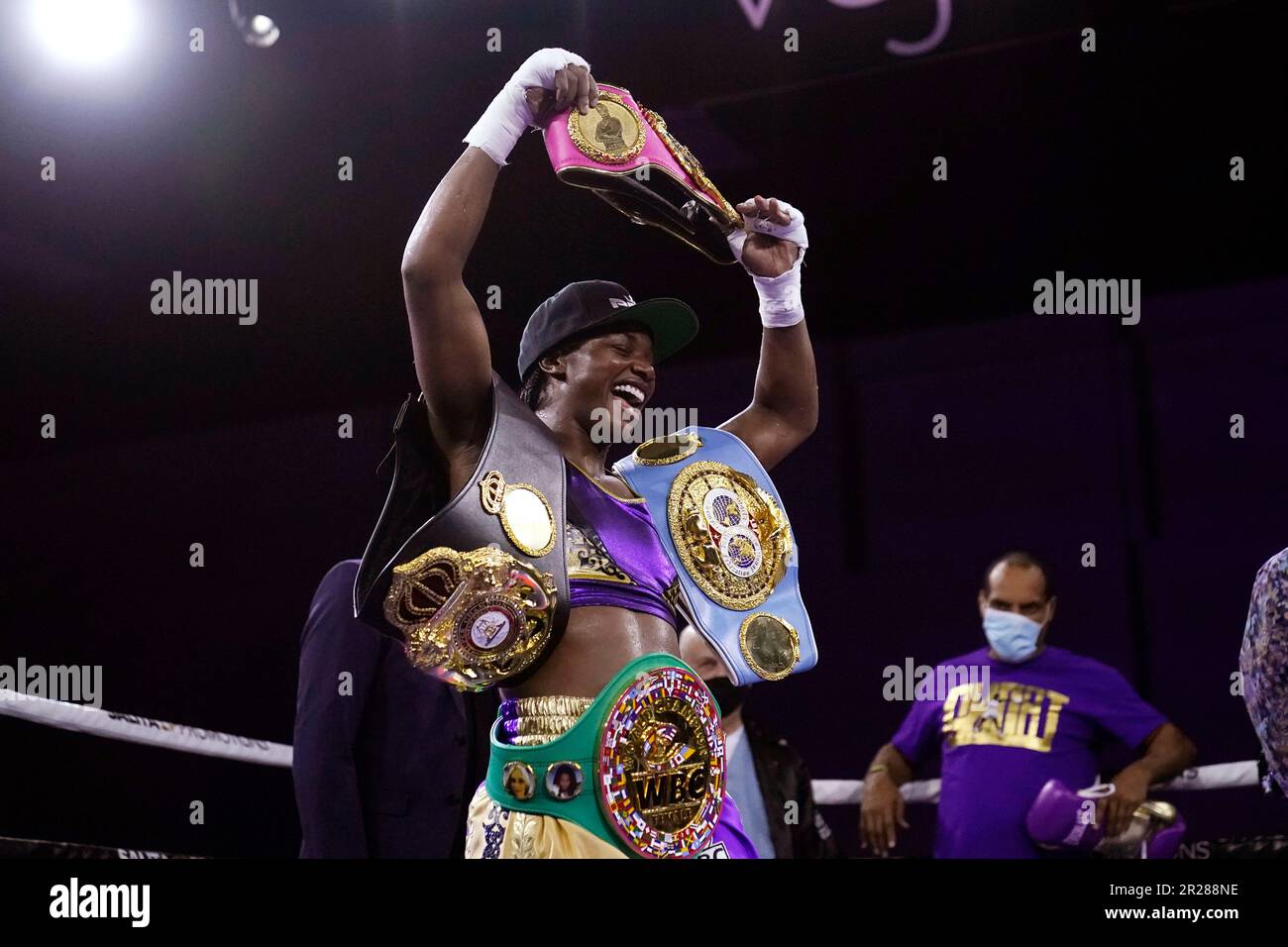 FILE - Claressa Shields holds her championship belts after defeating ...