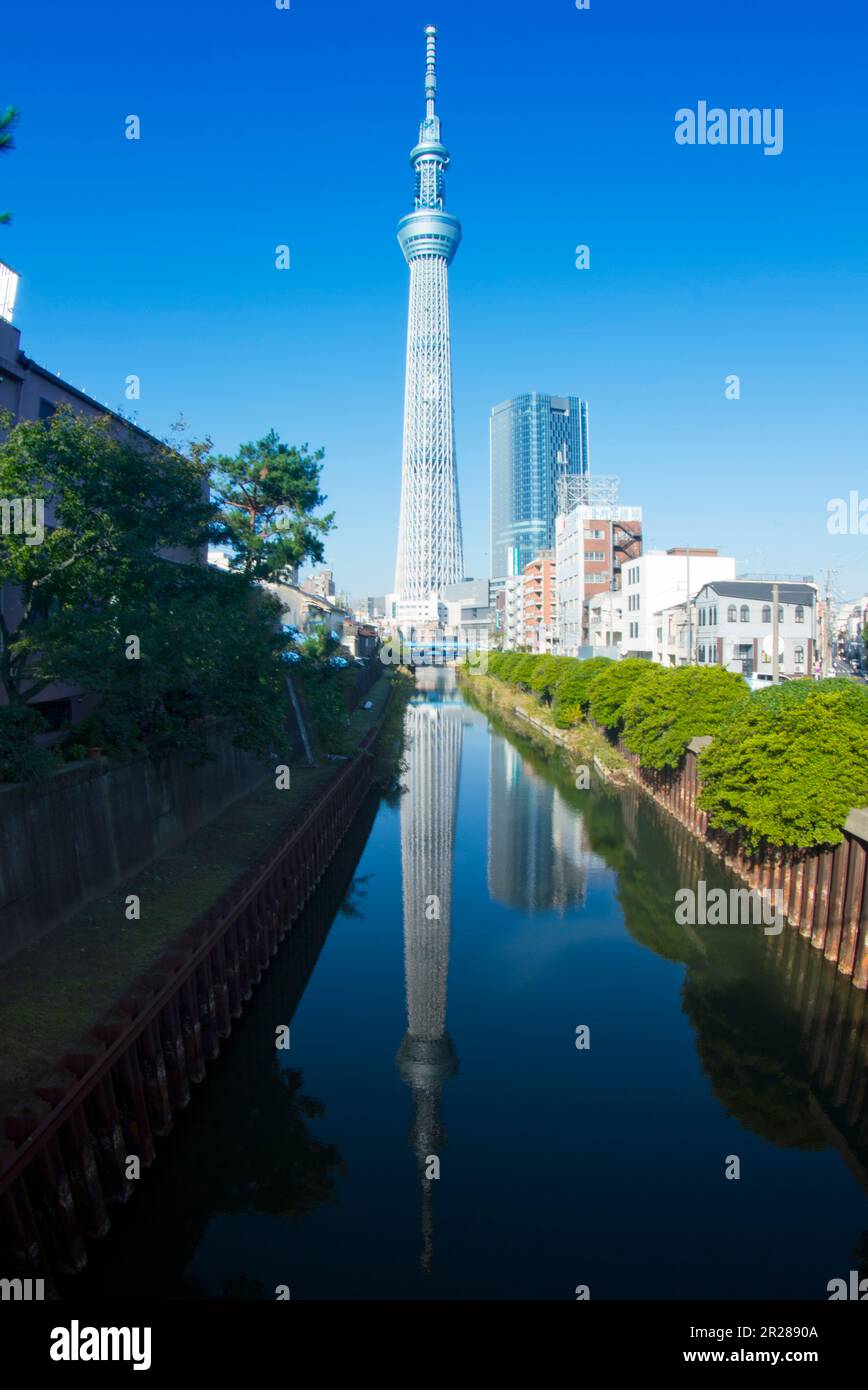 Double reflection of Tokyo Sky tree on the water surface Stock Photo ...