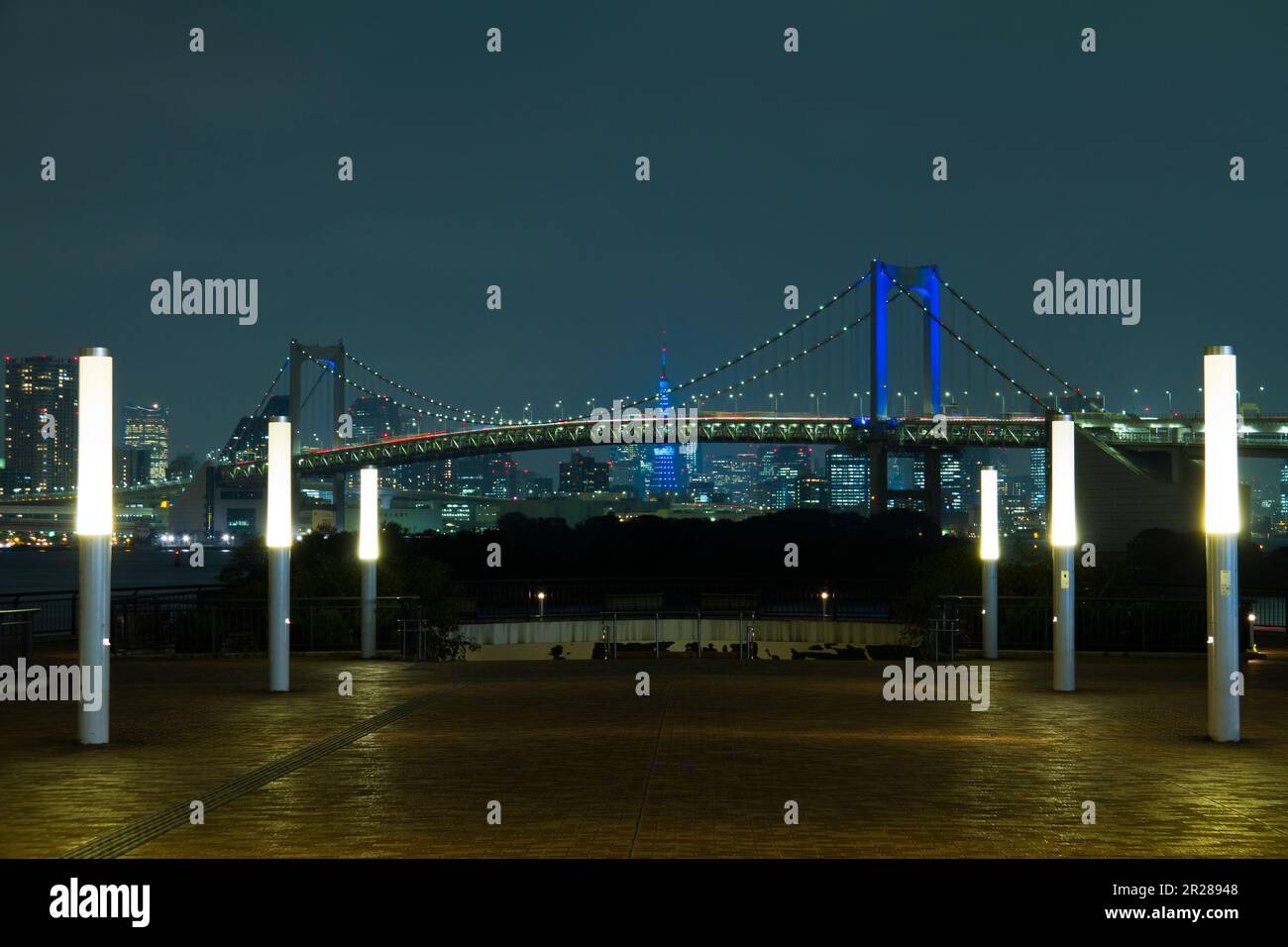 Rainbow Bridge lit up in blue and Tokyo Tower Stock Photo - Alamy