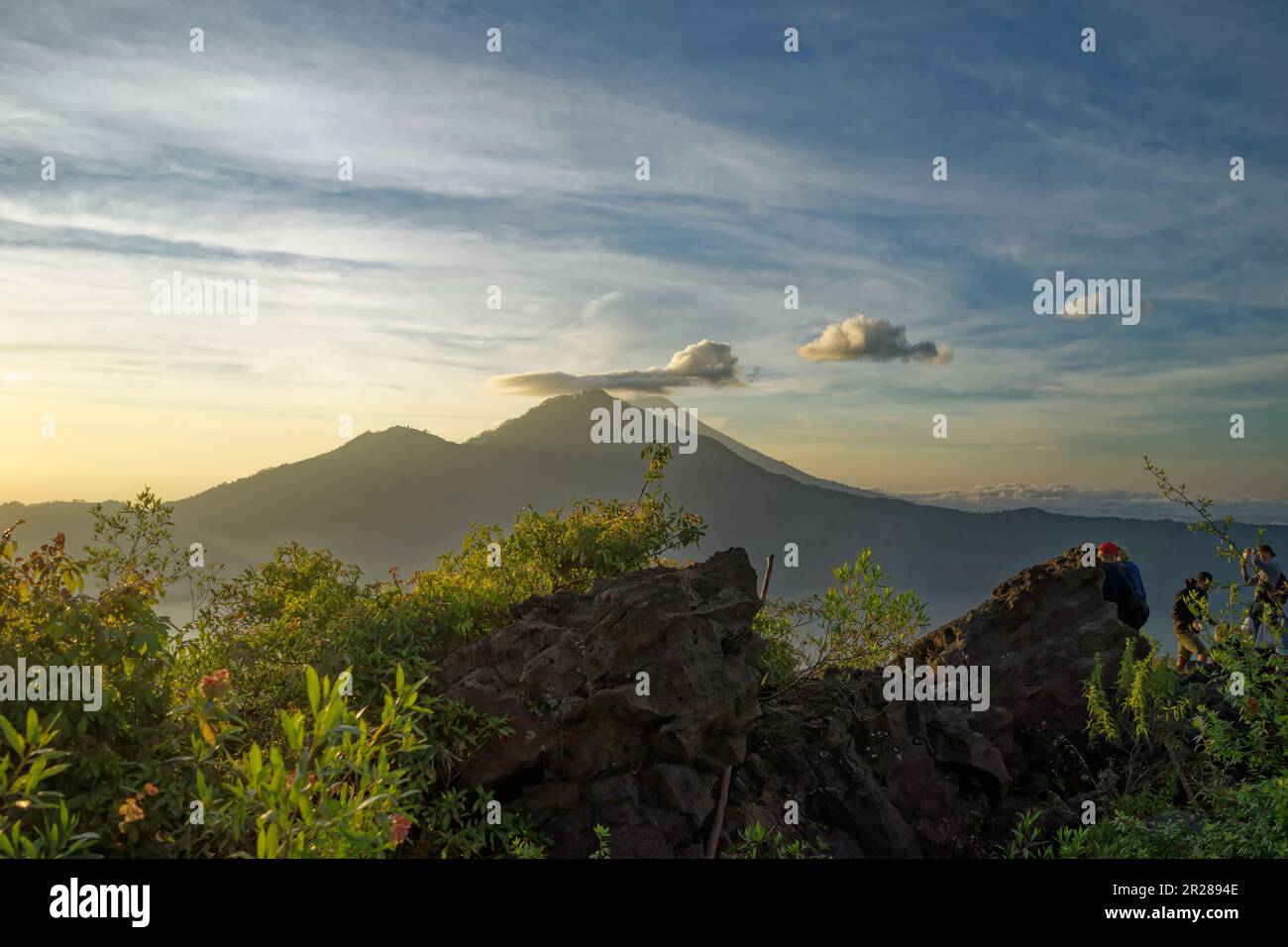 Sleeping volcano Gunung Agung in the morning sun of Bali Stock Photo ...