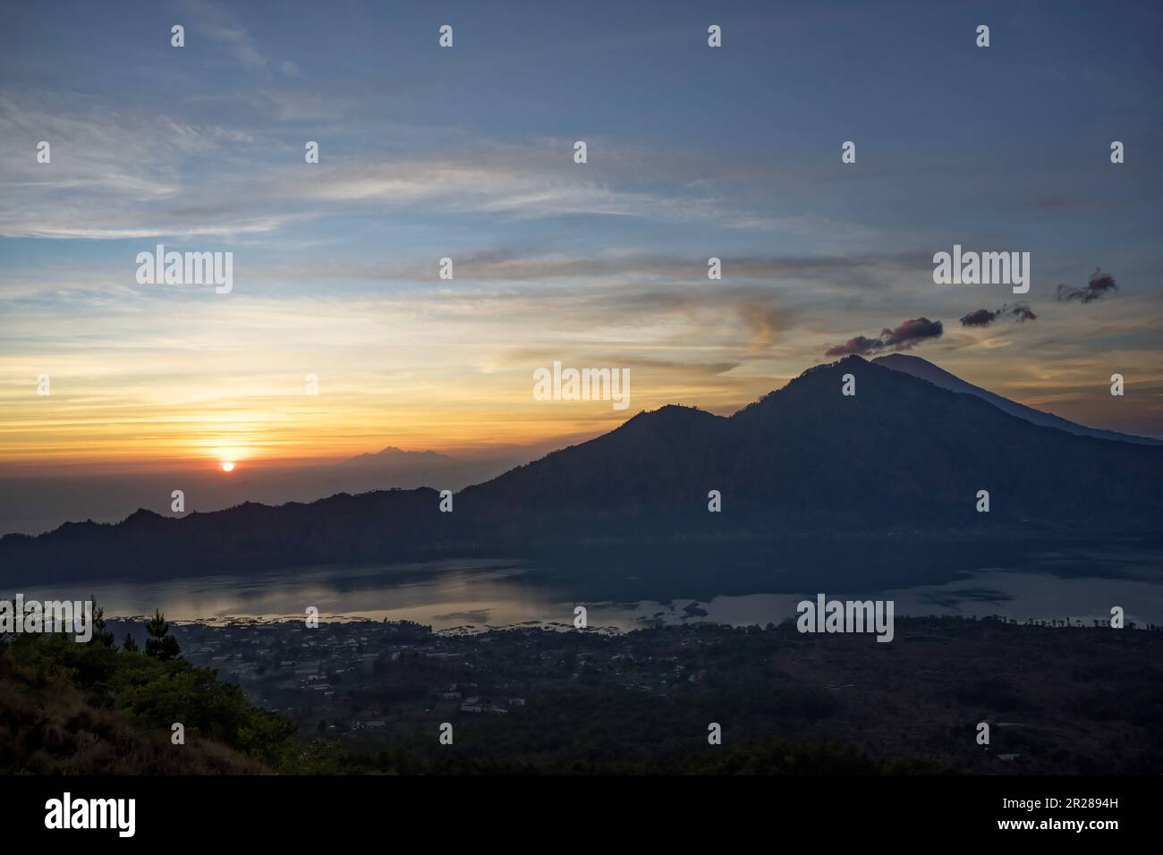 Sleeping volcano Gunung Agung in the morning sun of Bali Stock Photo ...