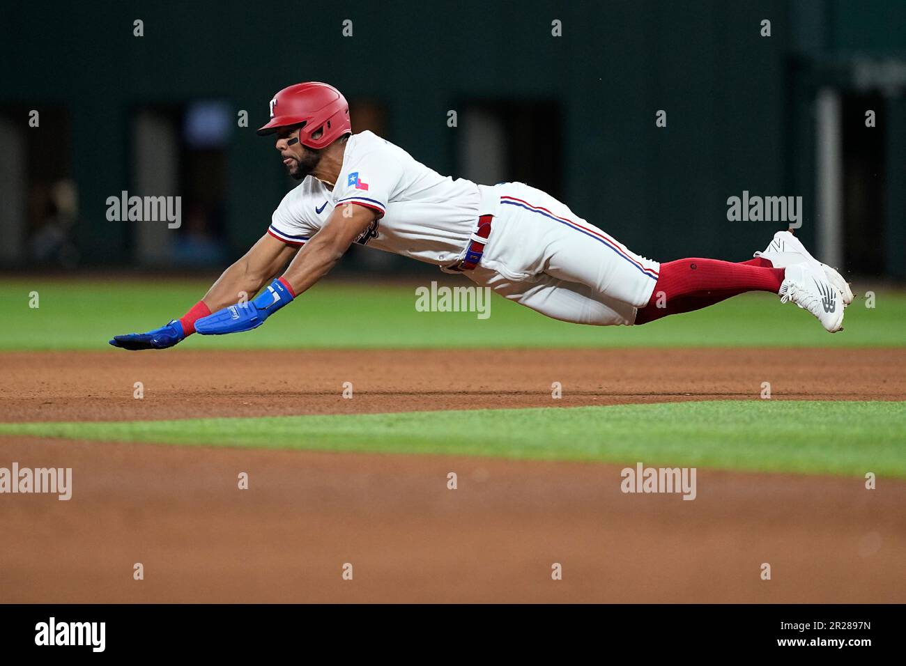 Texas Rangers' Leody Taveras dives into second during a baseball game ...