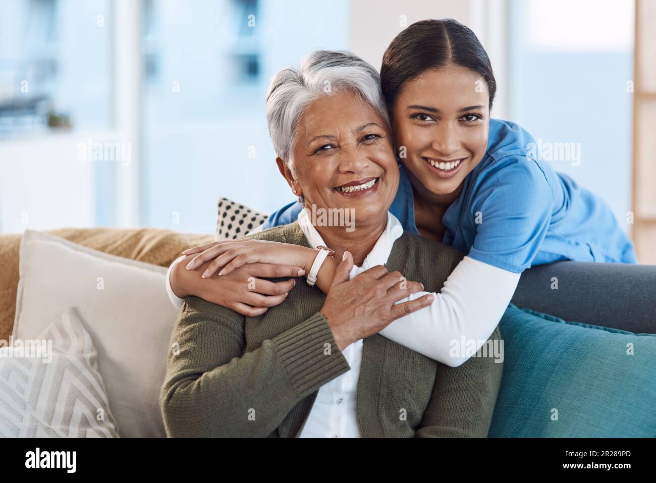 Smile Portrait And Nurse Hugging Old Woman In Retirement House