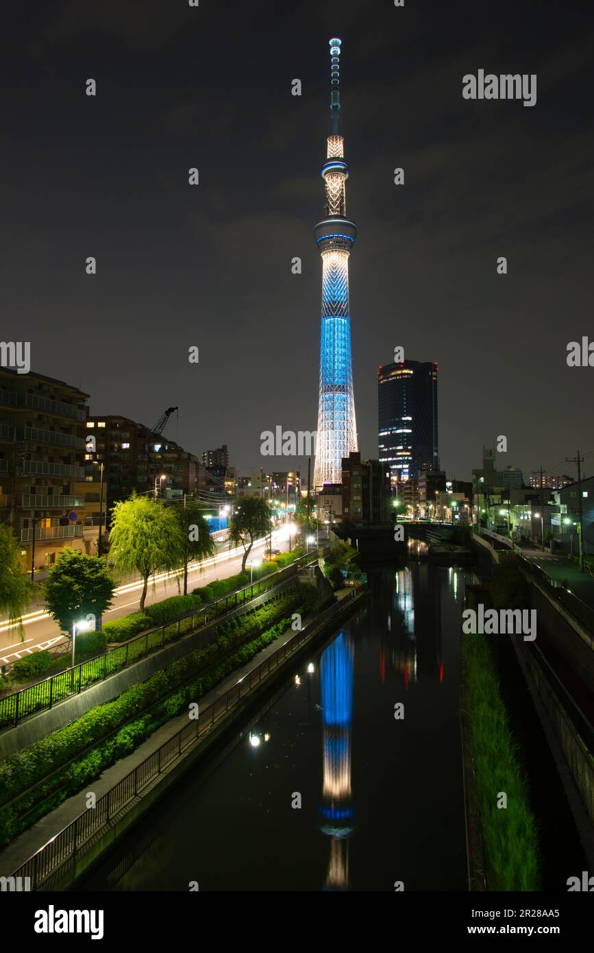 Tokyo Sky Tree lit up (Trendy) reflecting on water Stock Photo - Alamy