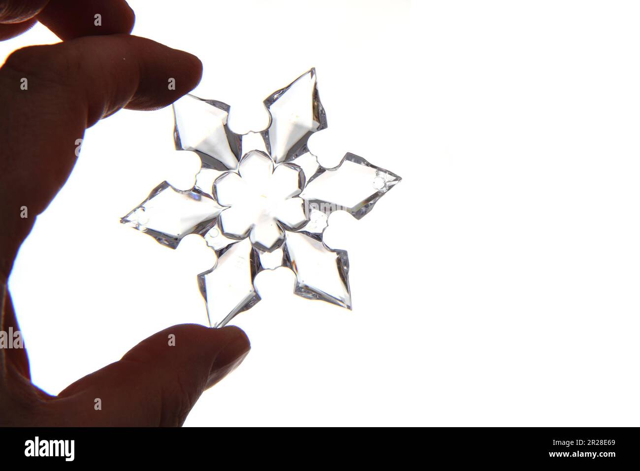 snowflake in the human hand isolated on the white background Stock ...