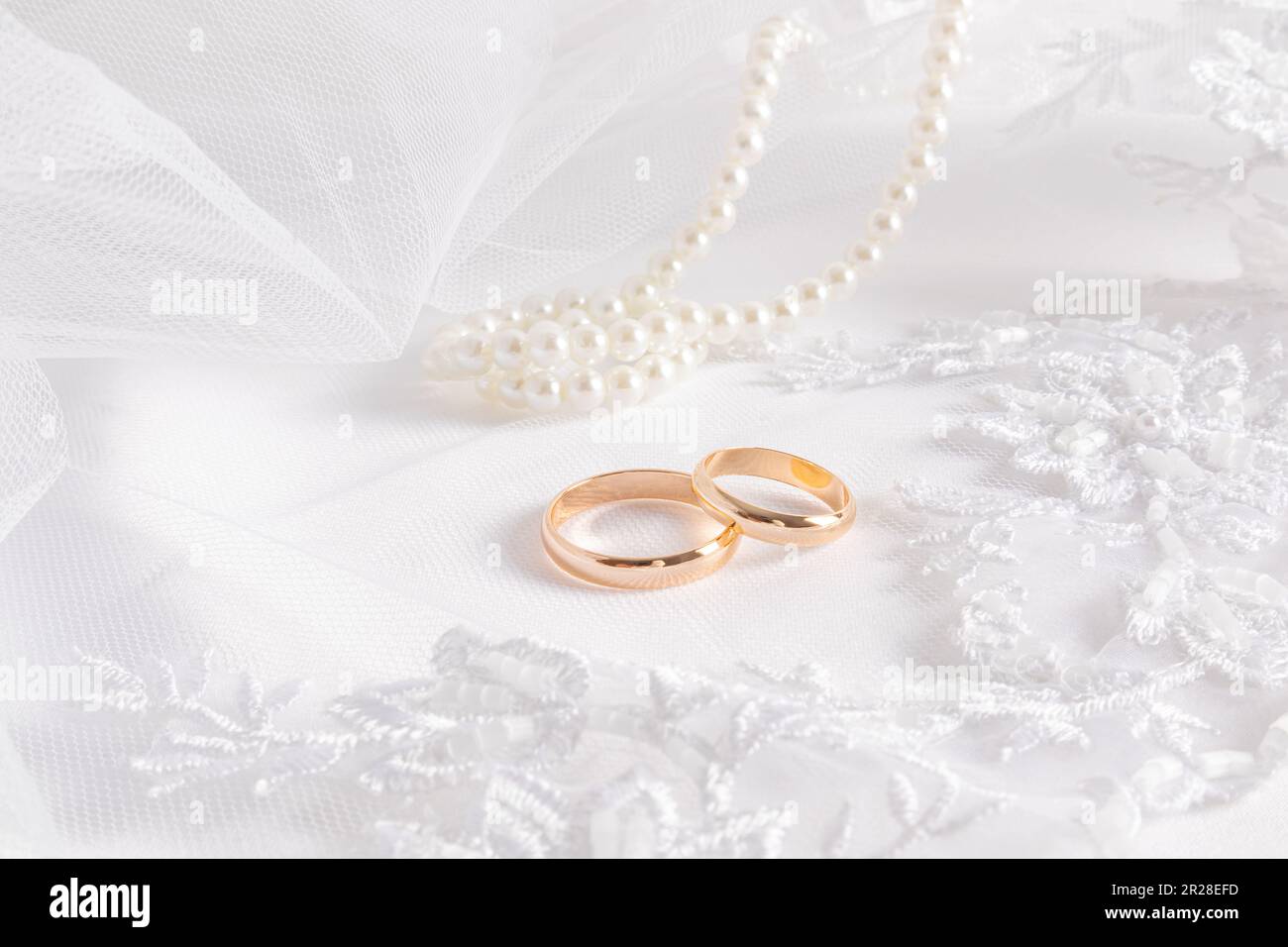 exquisite white airy lace bridal veils, two gold wedding rings and ...