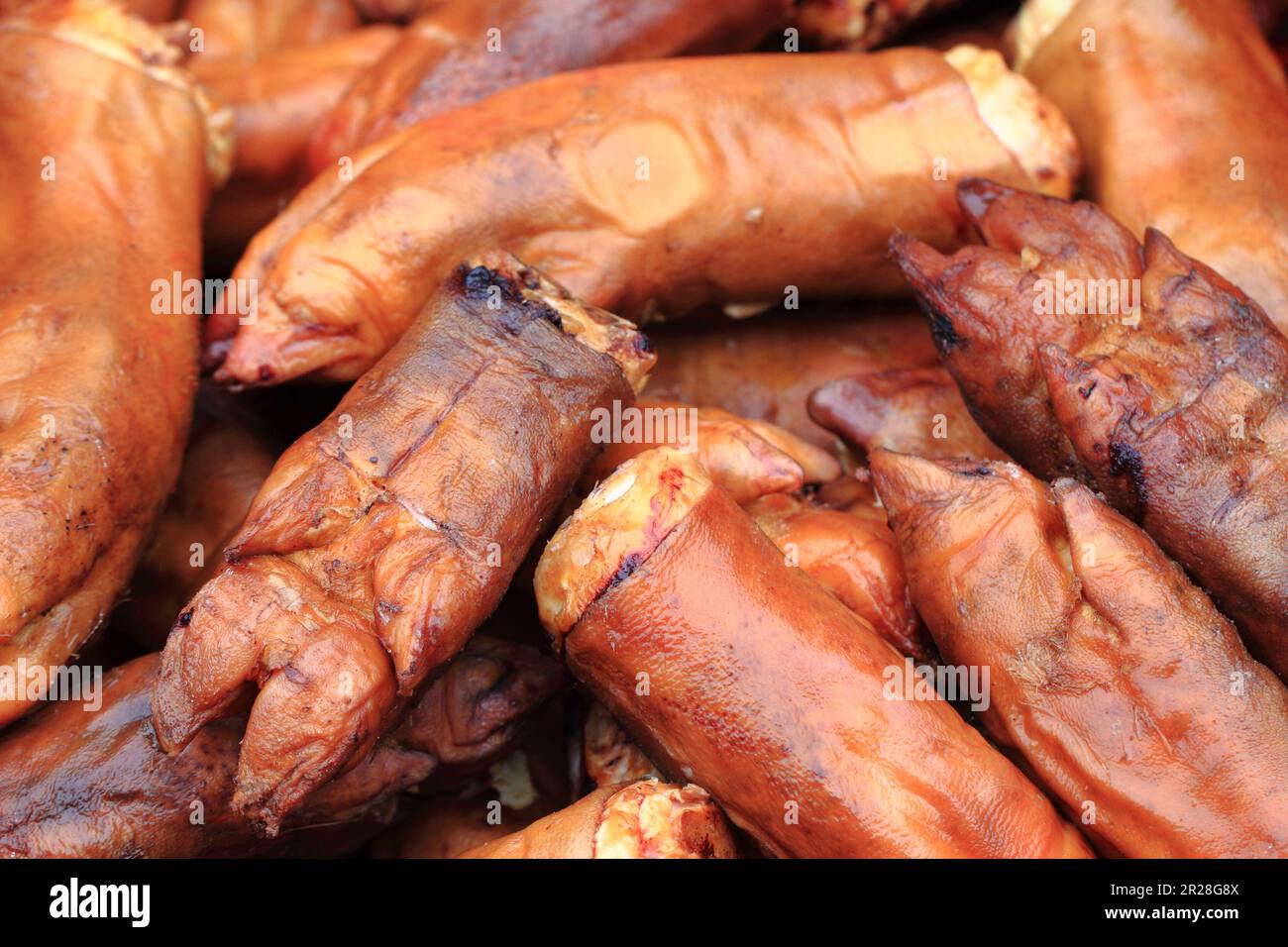 smoked pig legs texture as food for dogs Stock Photo - Alamy