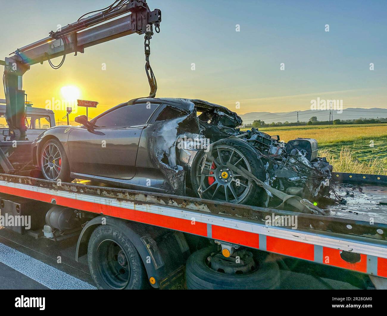 Renchen, Germany. 18th May, 2023. A burnt-out Ferrari lies on the back ...