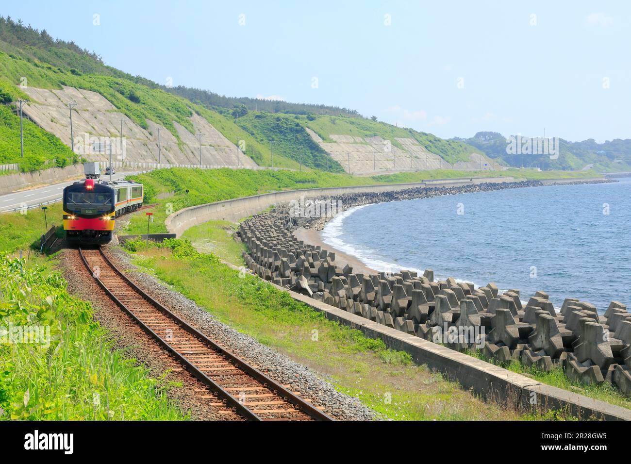 Japan Sea and Gono line in summer, Resort-Shirakami train of Kumagera ...
