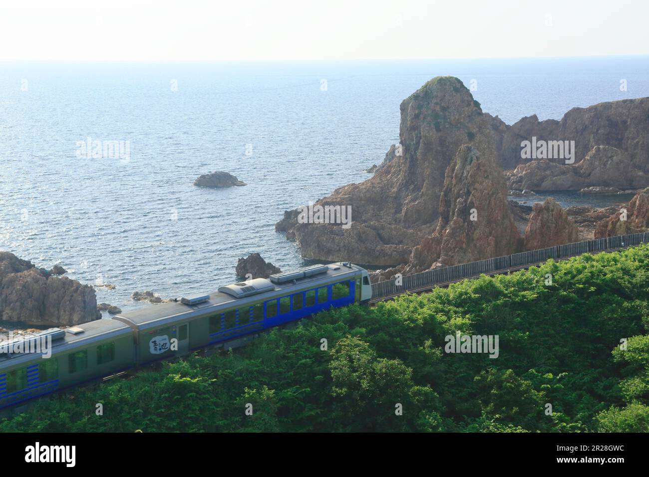 Japan Sea and Gono line train of Resort Shirakami Ao-ike Stock Photo ...