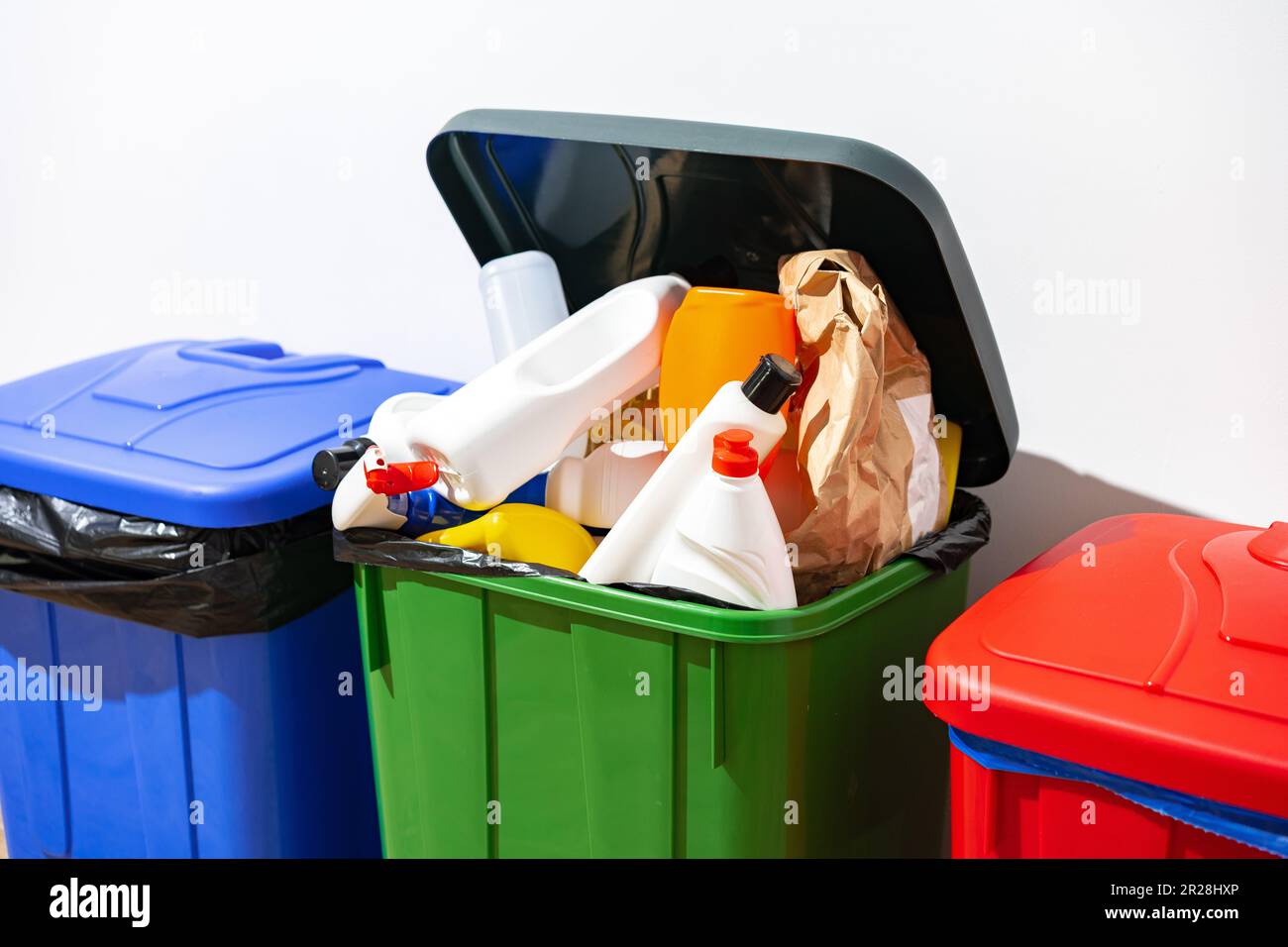 Trash cans full of waste in the building Stock Photo - Alamy