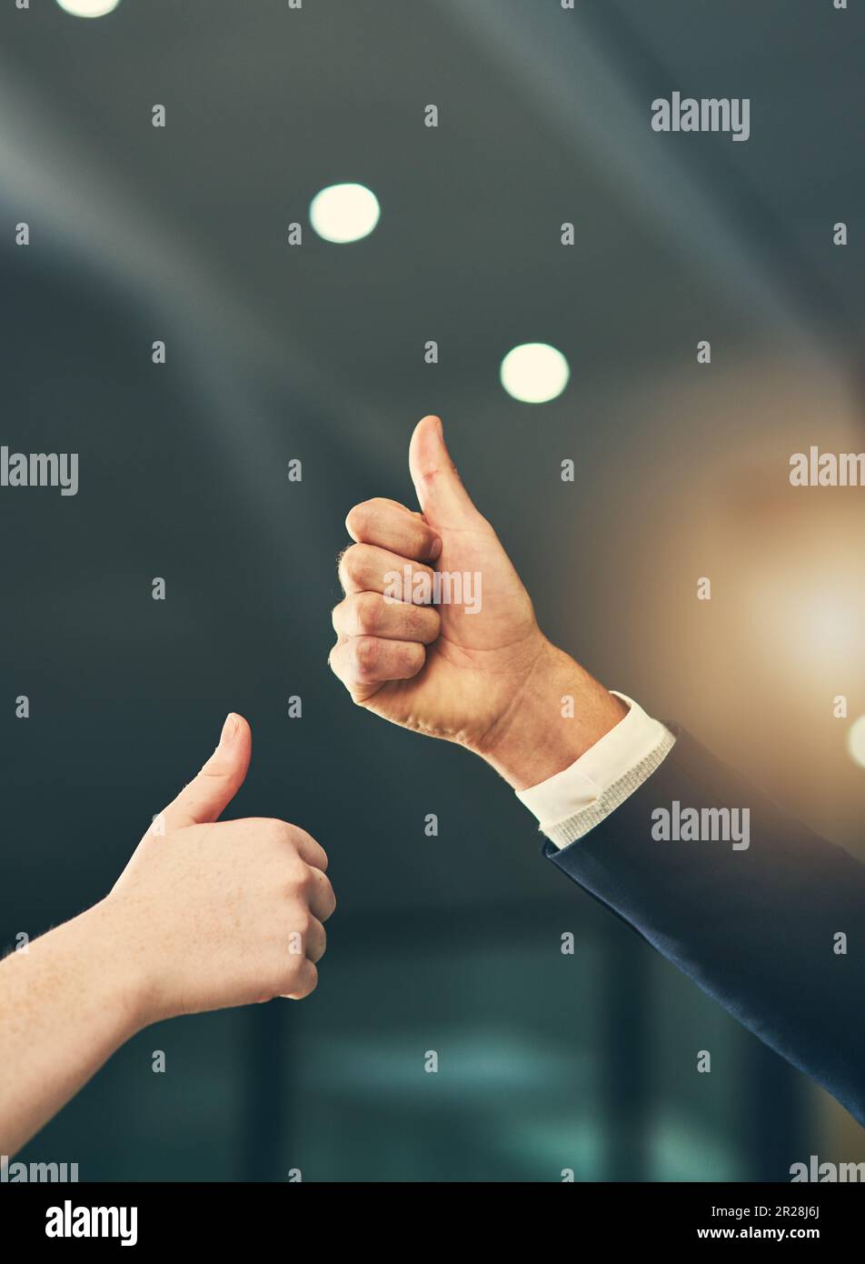 Hands of business men with thumbs up in office for feedback, good news ...