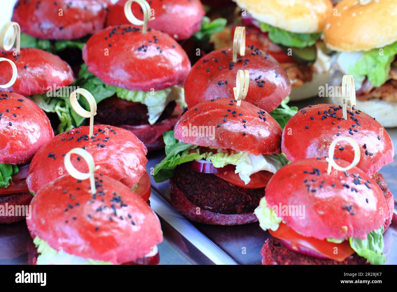 red vegan burgers as very nice background Stock Photo - Alamy