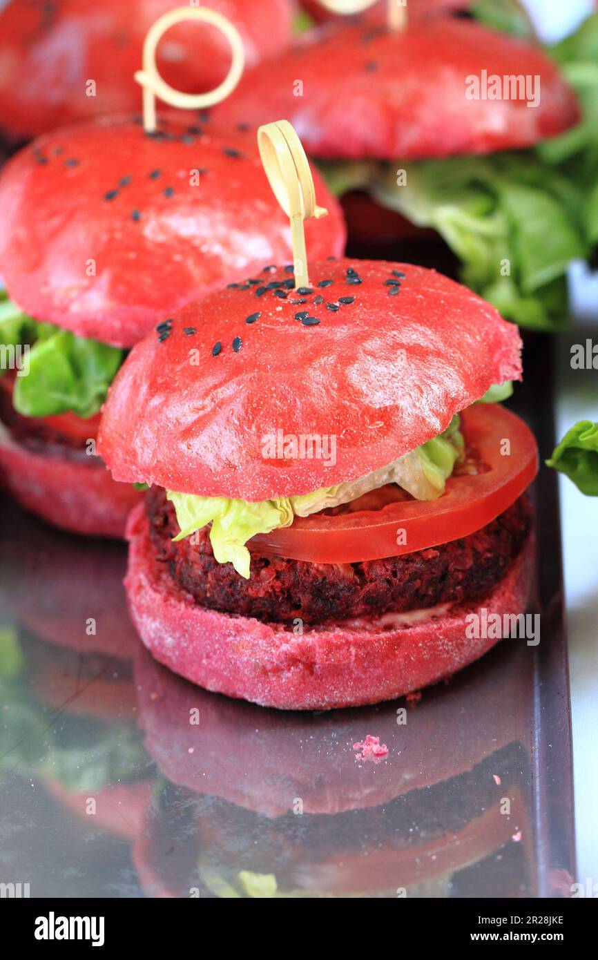 red vegan burgers as very nice background Stock Photo - Alamy