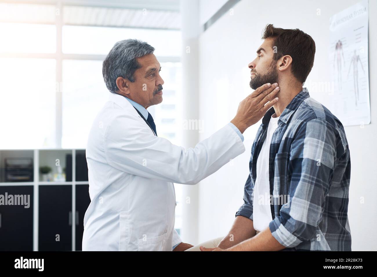 Healthcare, consultation and doctor checking neck of patient with ...