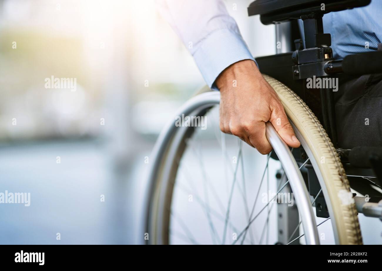 Wheelchair, disability and man hand holding wheel in a hospital for ...