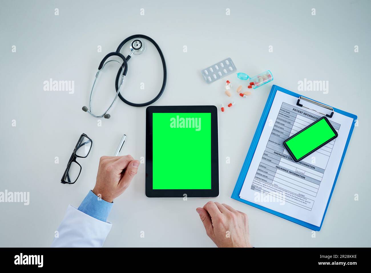 Tablet, green screen and doctor hands with medicine, documents and ...