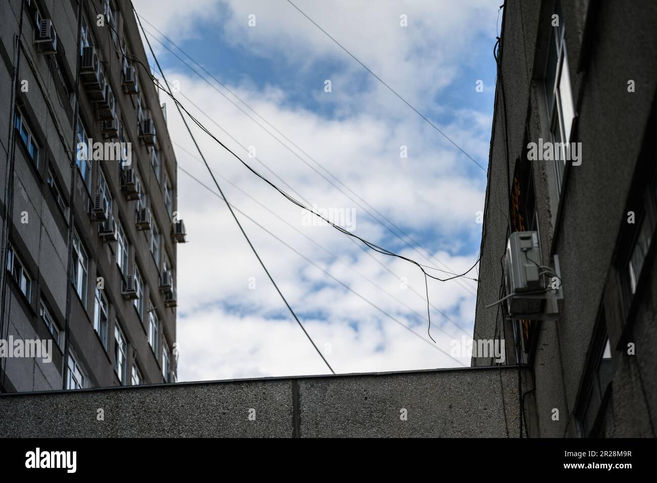 Wires and cables between two buildings Stock Photo - Alamy