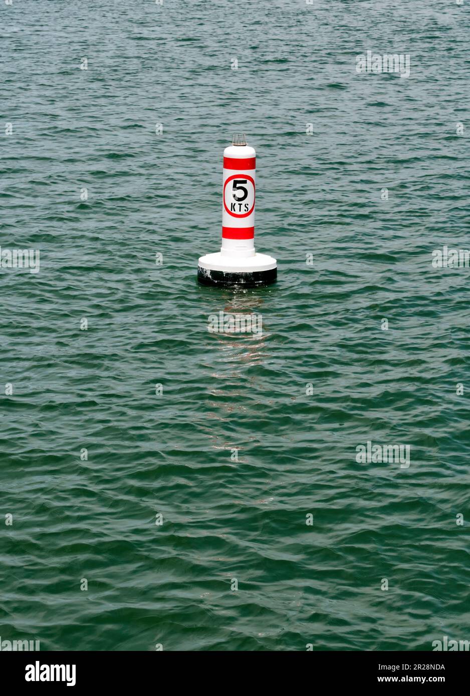 Speed limit sign on buoy for boats and water craft Stock Photo - Alamy