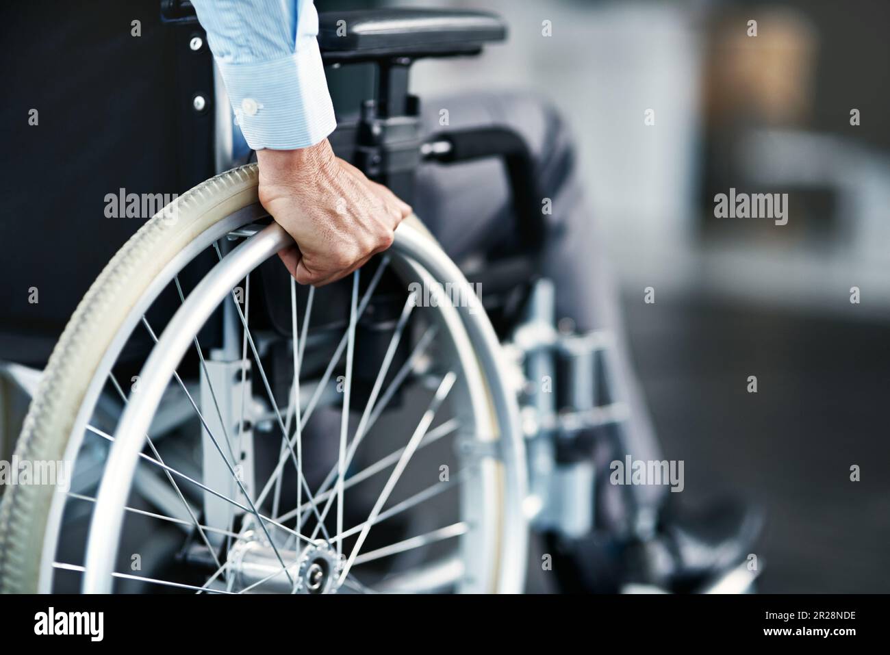 Wheelchair, disability and man hand holding wheel in a hospital for ...
