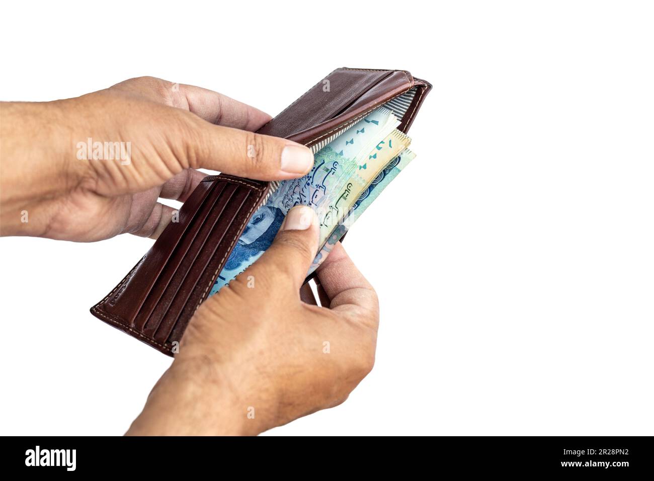 Taking out some currency notes from a wallet on isolated white ...