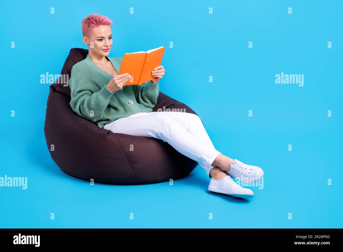 Full body size cadre of student woman pink hair dorm library chilling ...