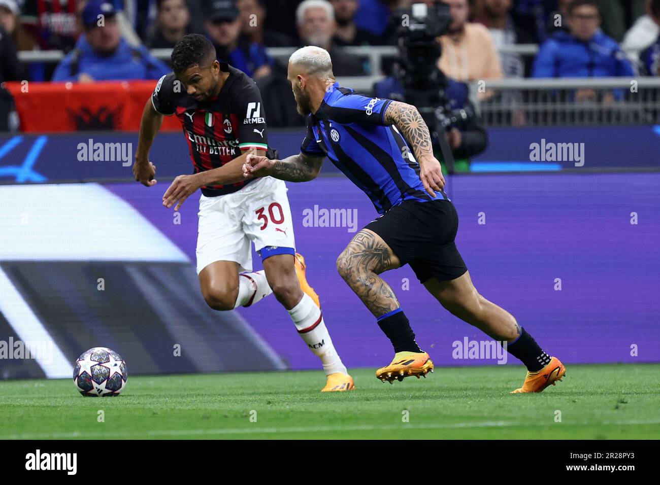 Junior Messias of Ac Milan and Federico Dimarco of Fc Internazionale battle for the ball during ...