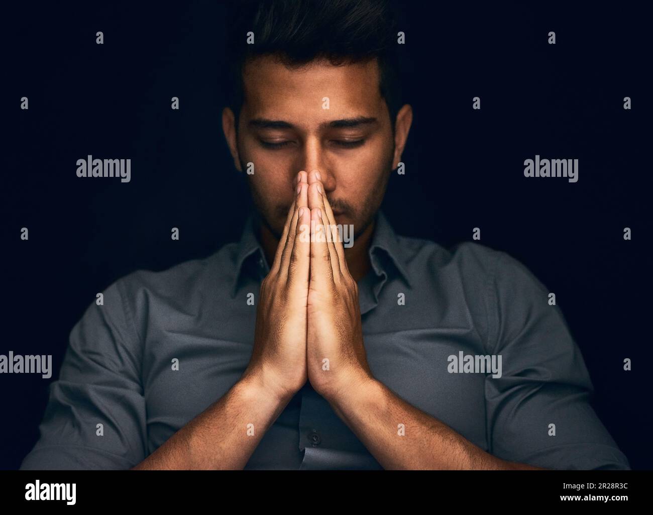 Night, worship and man with hands praying in studio to God, Jesus ...