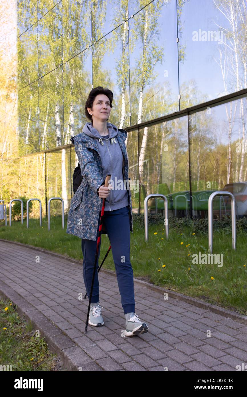 Nordic Walking In Urban City. Beautiful Happy Caucasian Woman Training ...