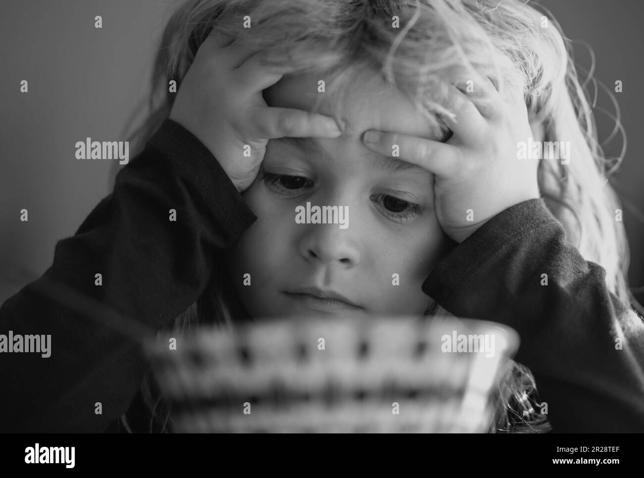 Portrait of sad child having breakfast at home. Portrait of sweet ...