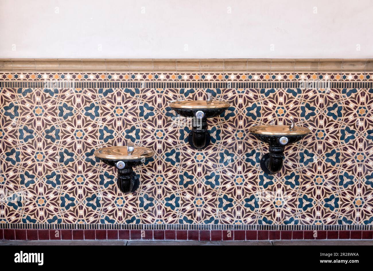 Drinking fountains on the wall with colorful Spanish style tiles Stock ...