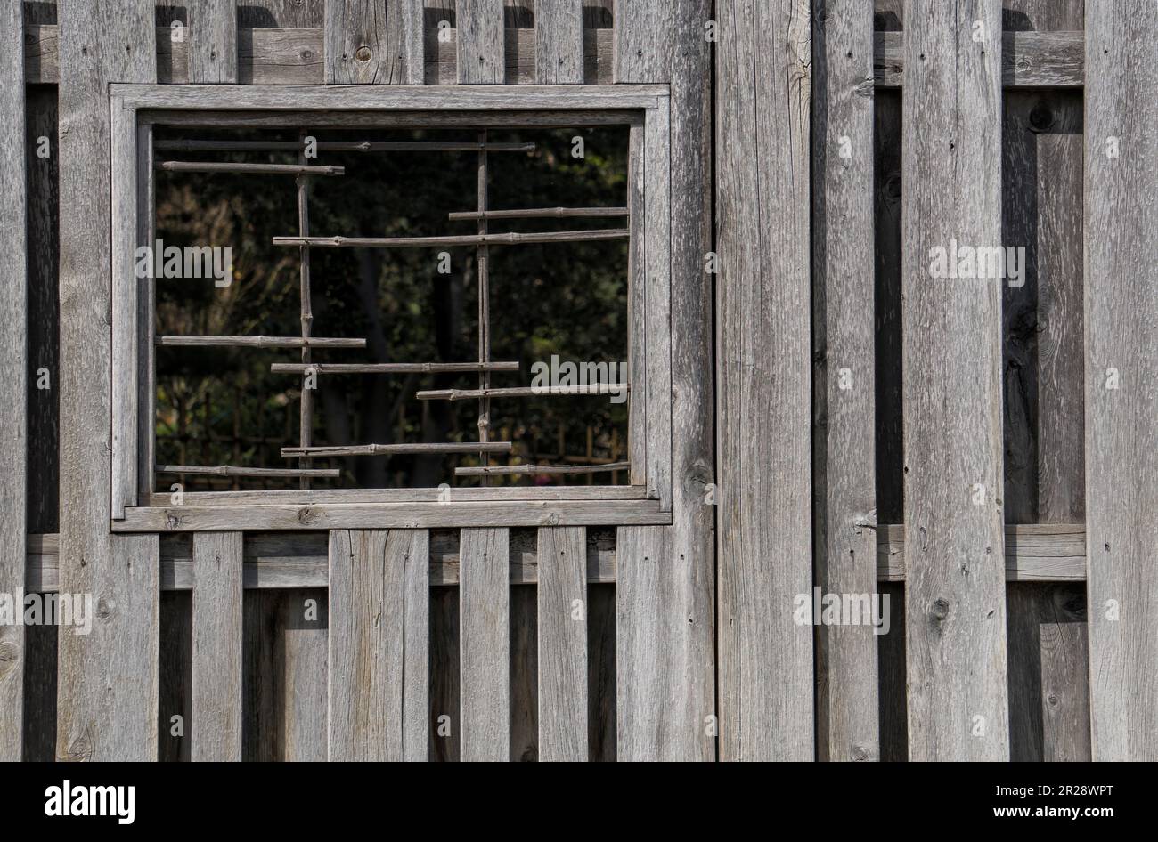 An old garden fence with the window Stock Photo - Alamy