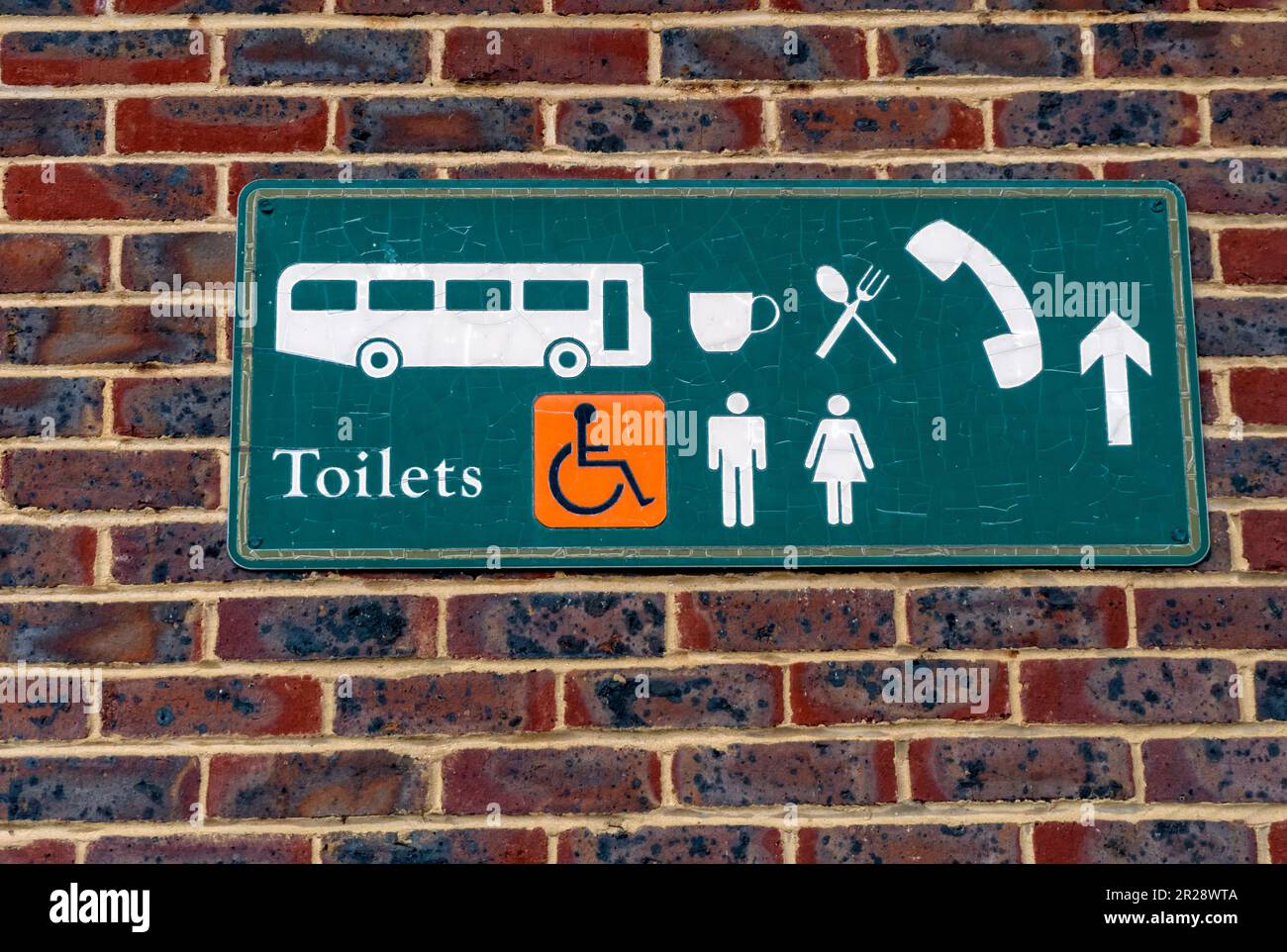 Information sign on the brick wall Stock Photo - Alamy