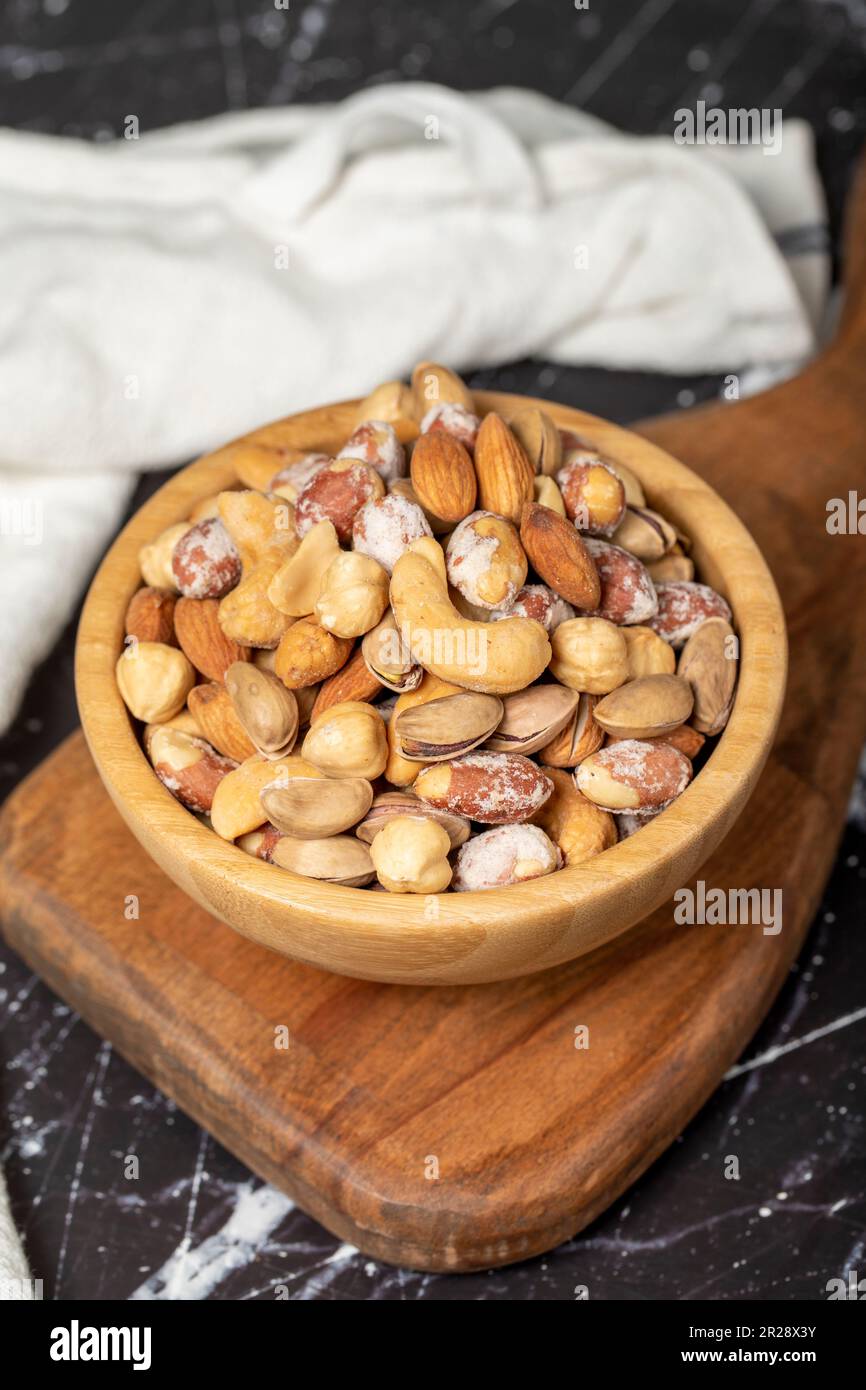 Mixed nuts. Special mixed nuts in a wooden bowl. Nuts, pistachios ...