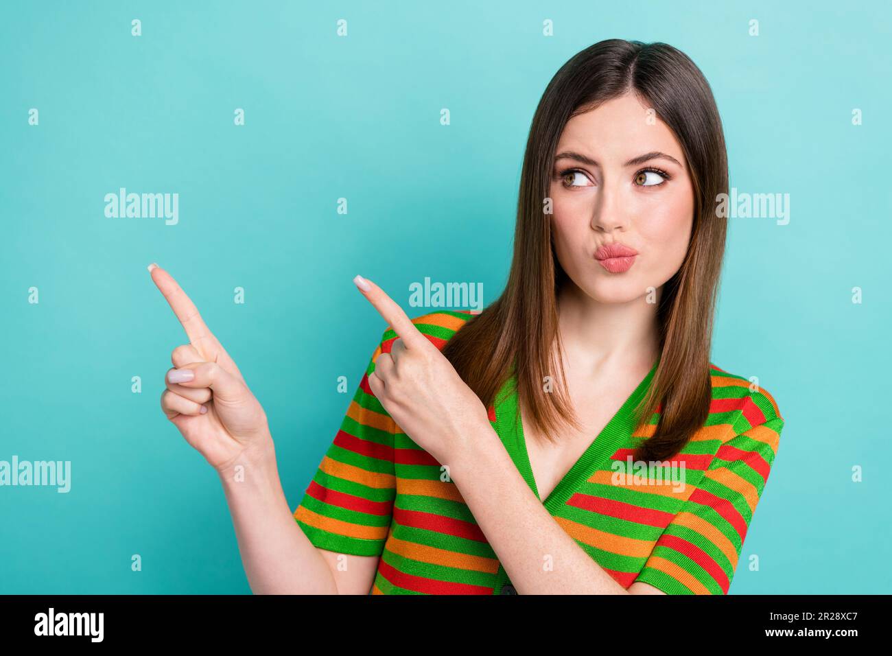 Photo of doubtful unsure woman dressed striped looking pointing two ...