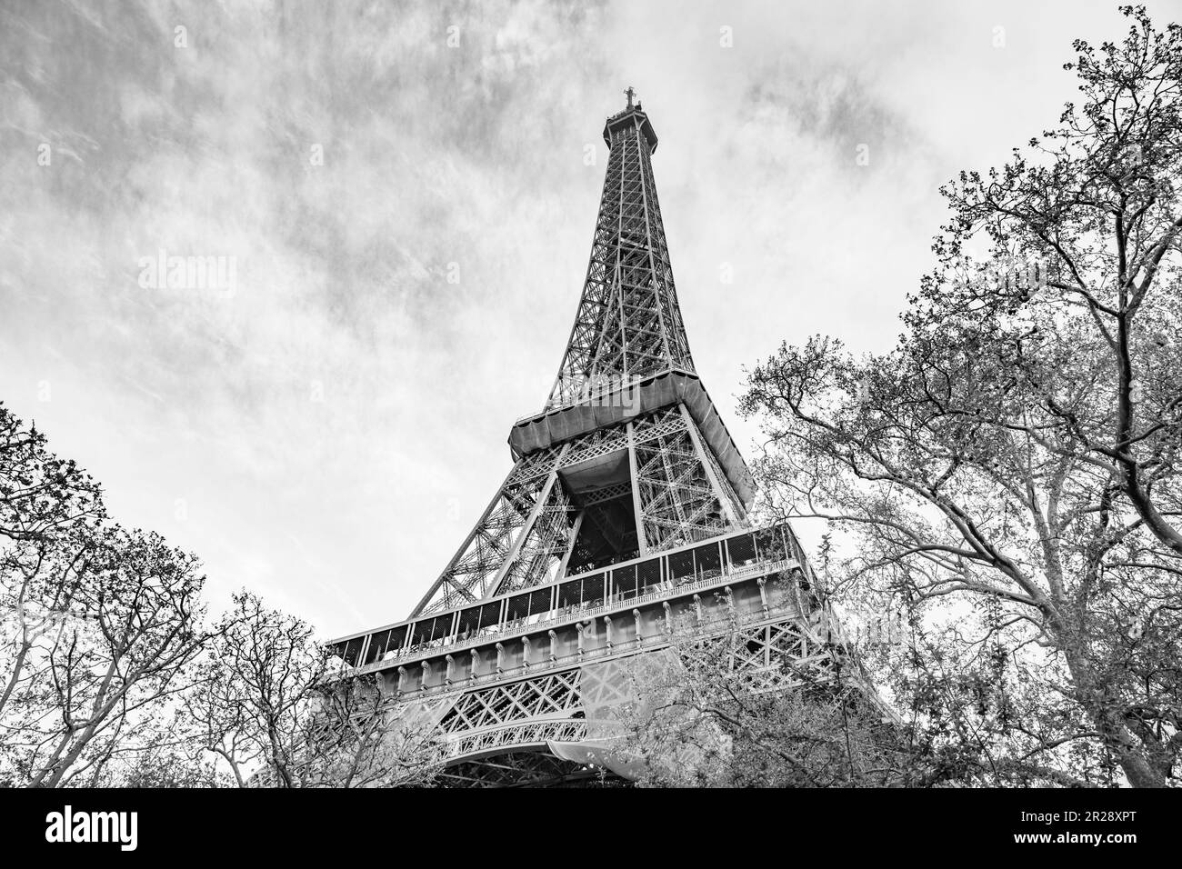 Morning view of Eiffel Tower from bottom. Paris, France. Black and ...
