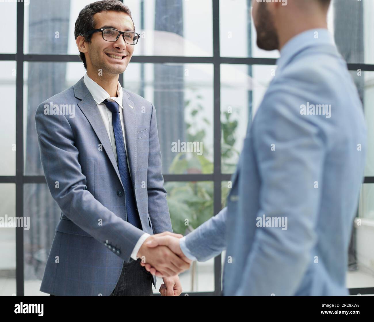 Two business men shaking hands together after successful meeting Stock ...