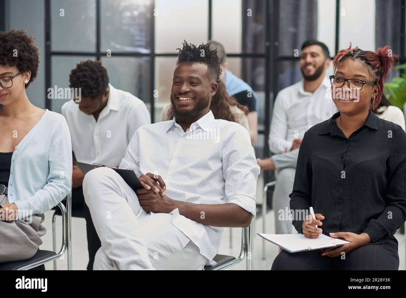 Business crowd in auditorium listeing to speech Stock Photo - Alamy