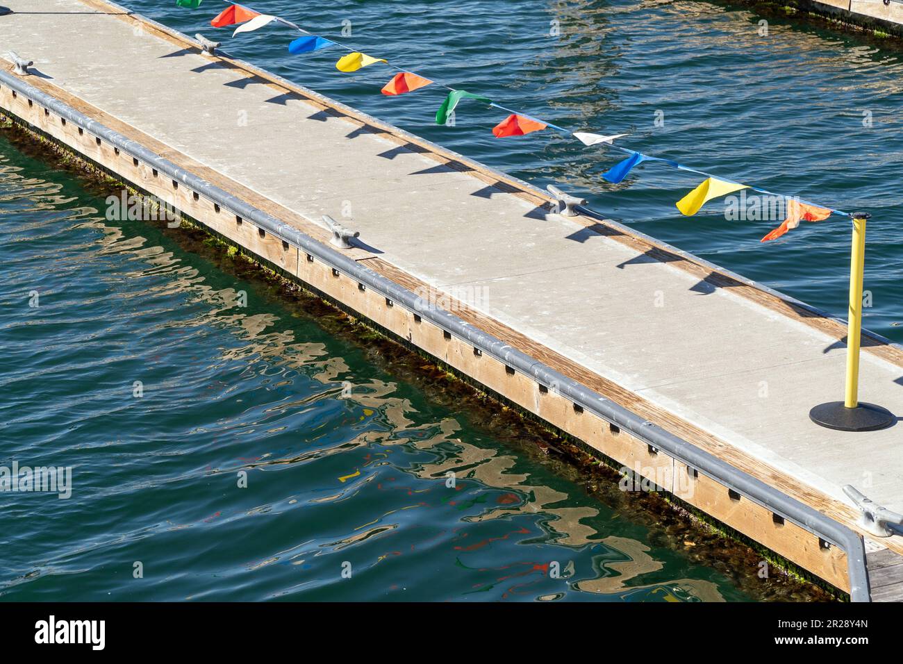 Colorful string pennants on a marina dock. Summer time and sunny Stock ...