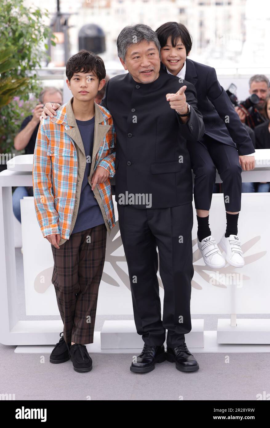 Soya Kurokawa, left, and director Hirokazu Koreeda, and Hinata Hiiragi pose for photographers at ...