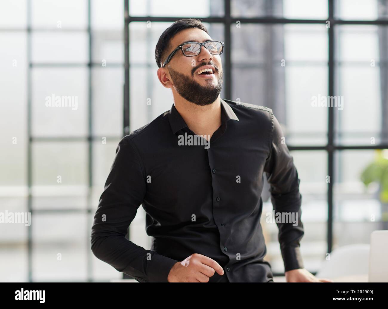 portrait of a young businessman who is smiling Stock Photo - Alamy