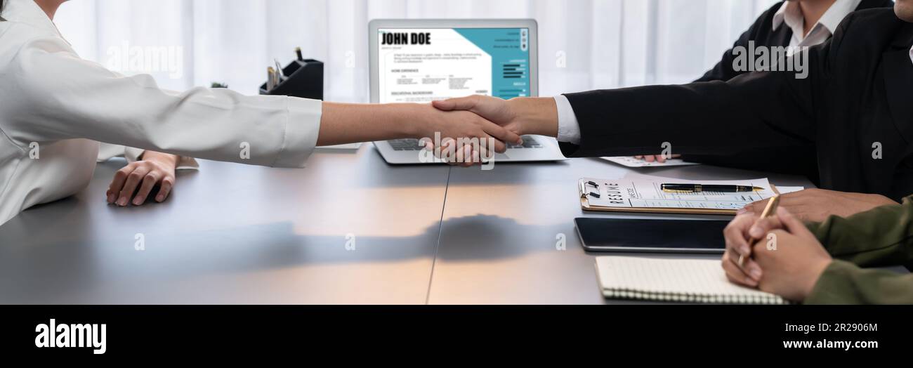 Interviewer handshaking the applicant hi-res stock photography and ...