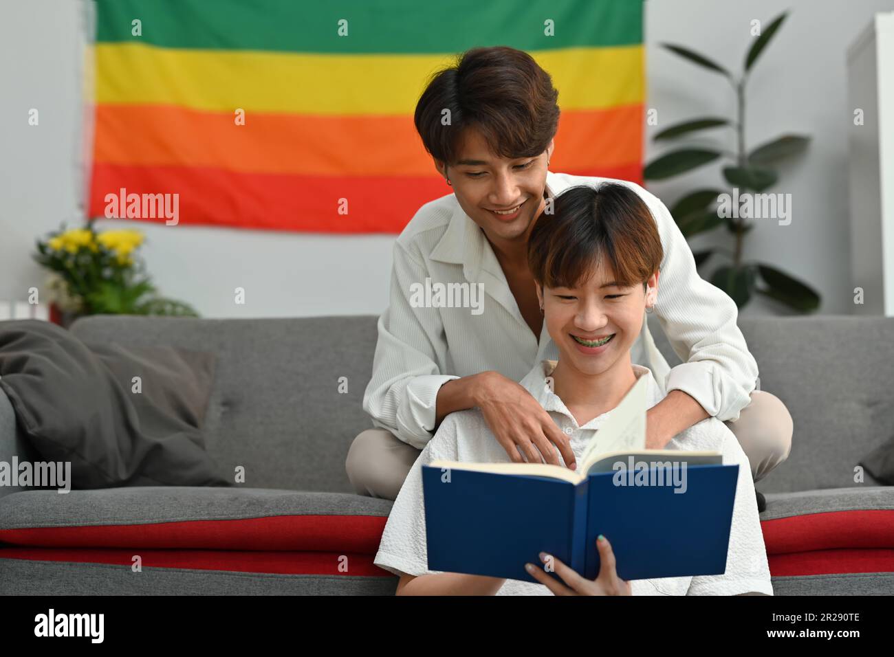 Romantic couple cuddling reading love hi-res stock photography and ...