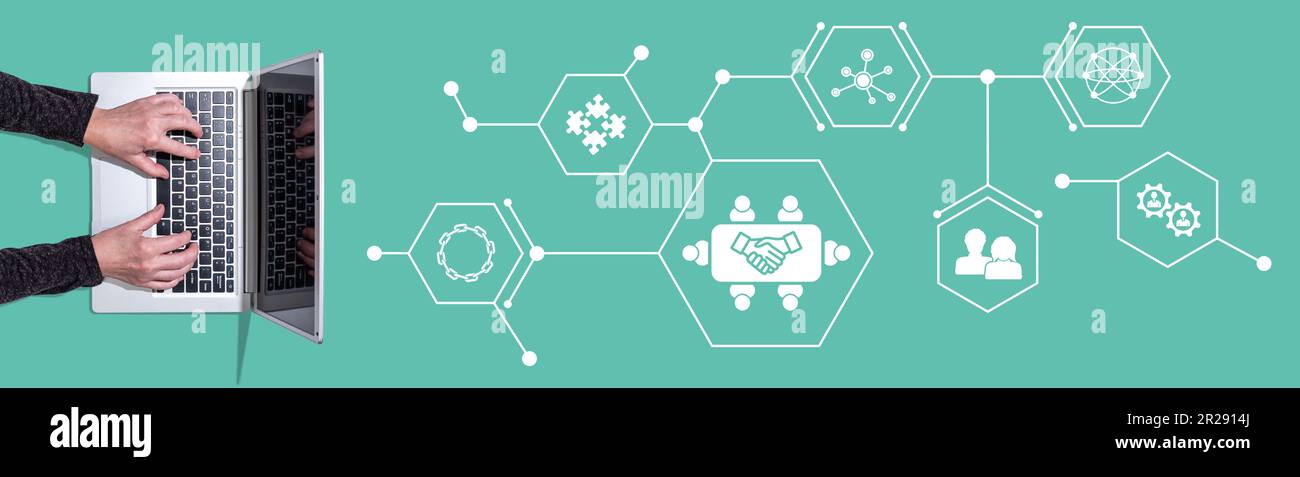 Top view of hands using laptop with symbol of business relationship ...