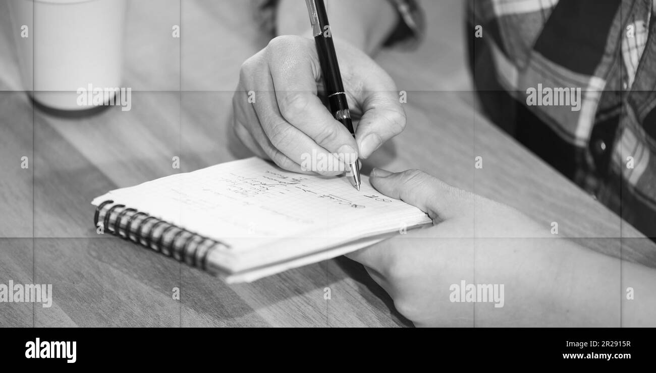 Female hands taking notes on notepad, geometric pattern Stock Photo - Alamy