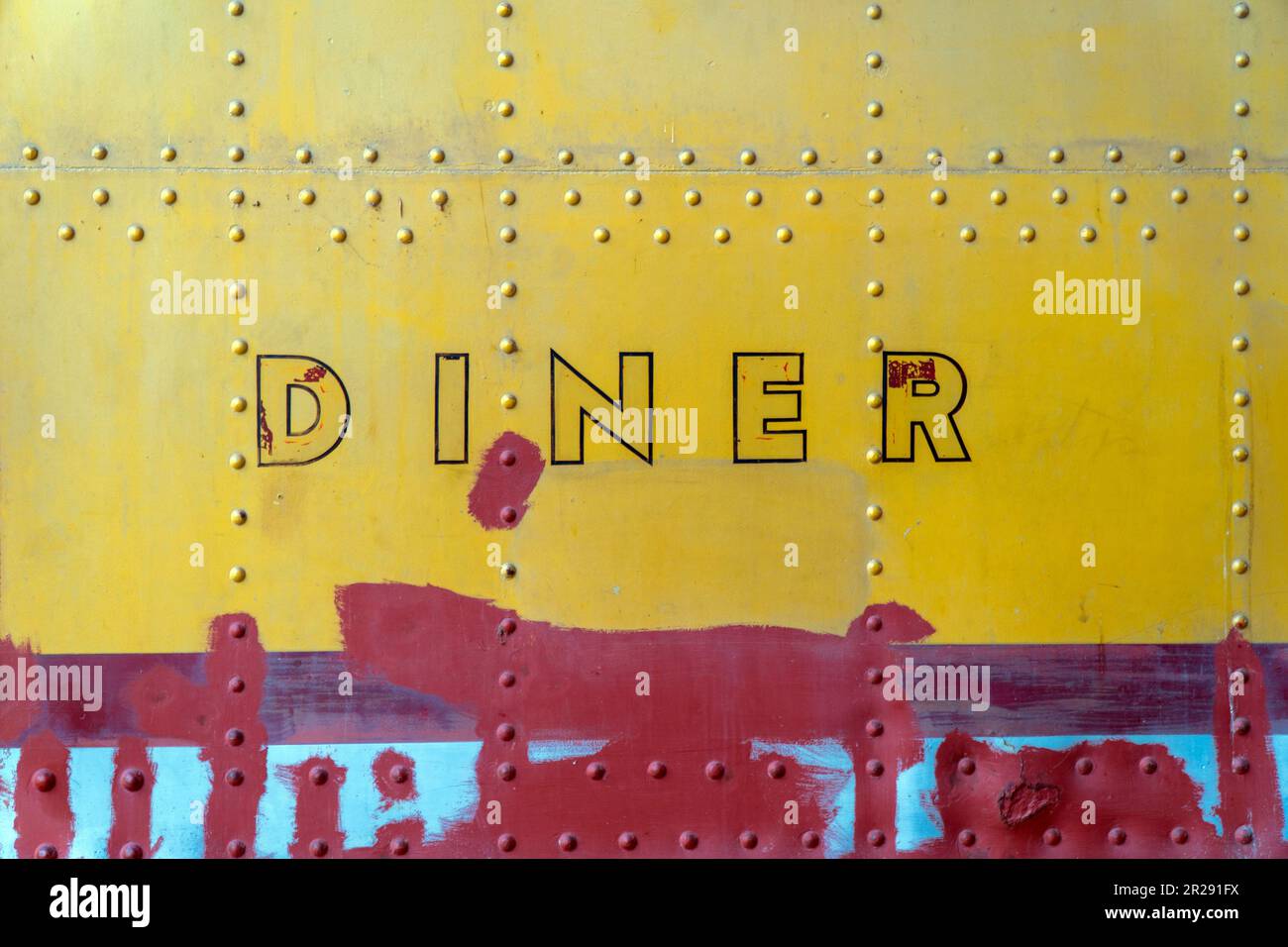 Detail of old colorful metal with rivets and DINER text Stock Photo - Alamy