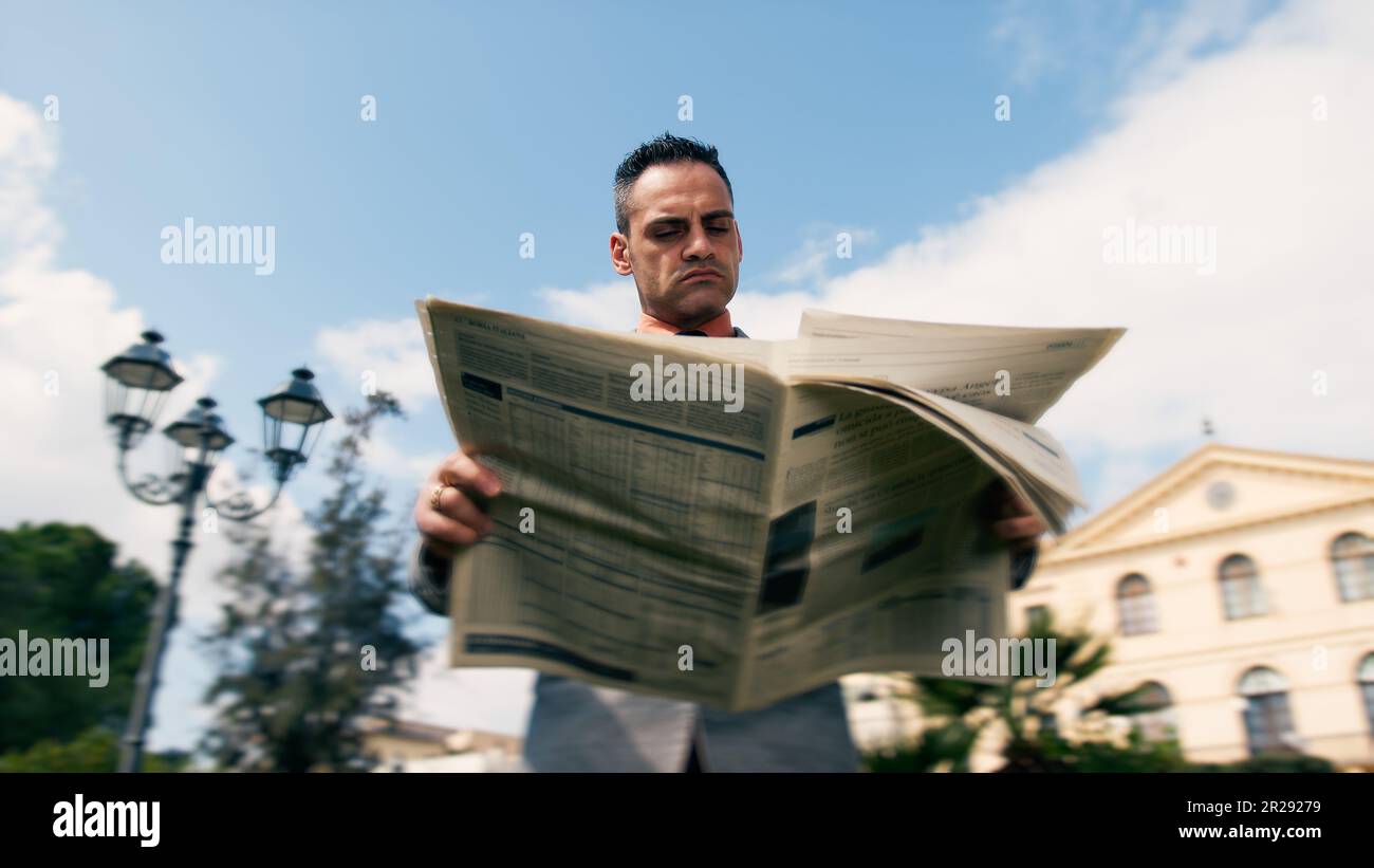 Business Man Read The Newspaper Stock Photo - Alamy